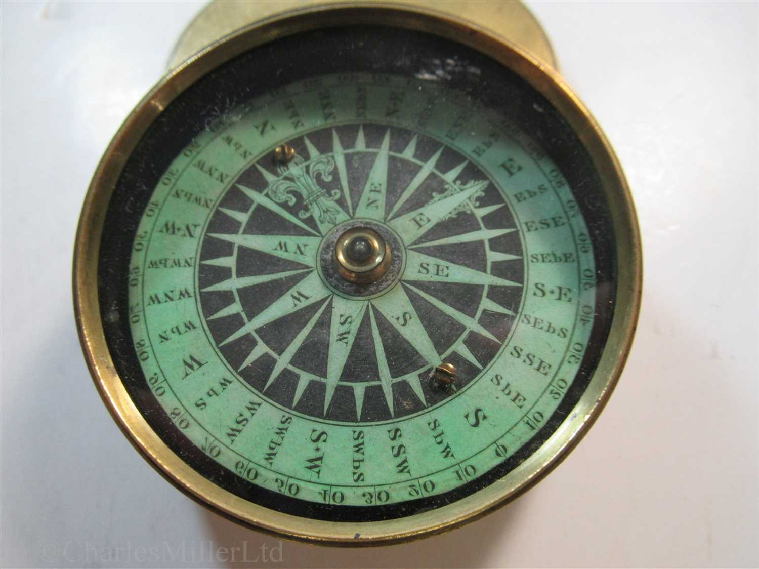 Lot 265 - AN 18TH CENTURY POCKET COMPASS SUNDIAL; and