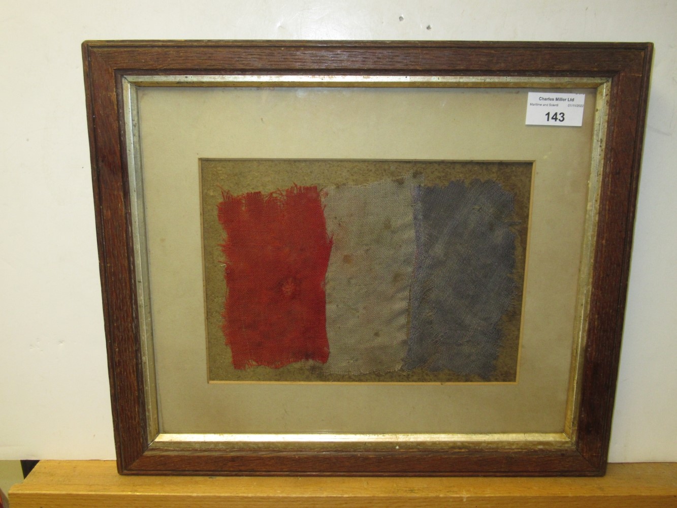 Lot 143 - A TRAFALGAR FLAG FRAGMENT FROM LORD NELSON'S
