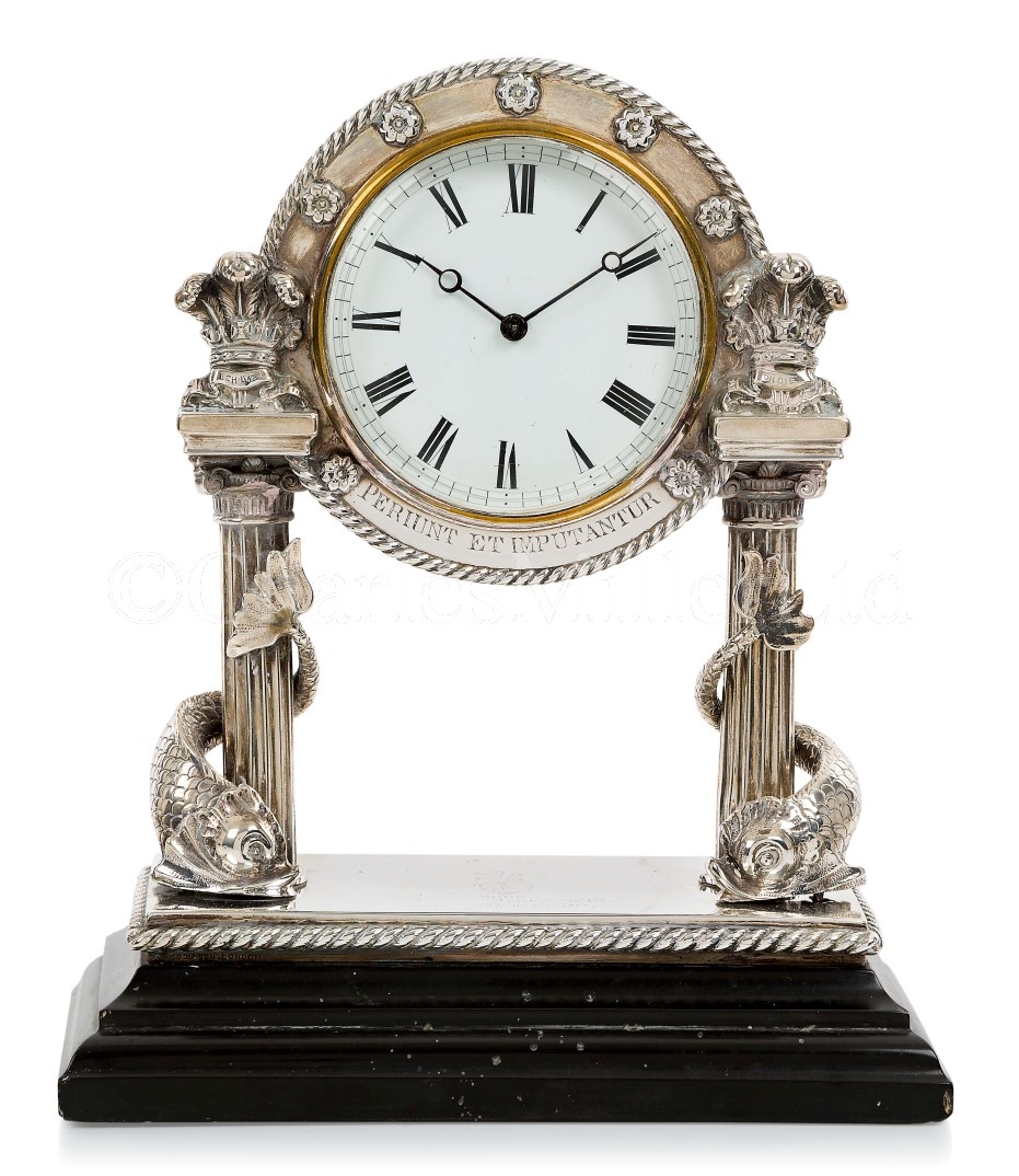Lot 236 - A DECORATIVE SILVER MANTLE CLOCK PRESENTED