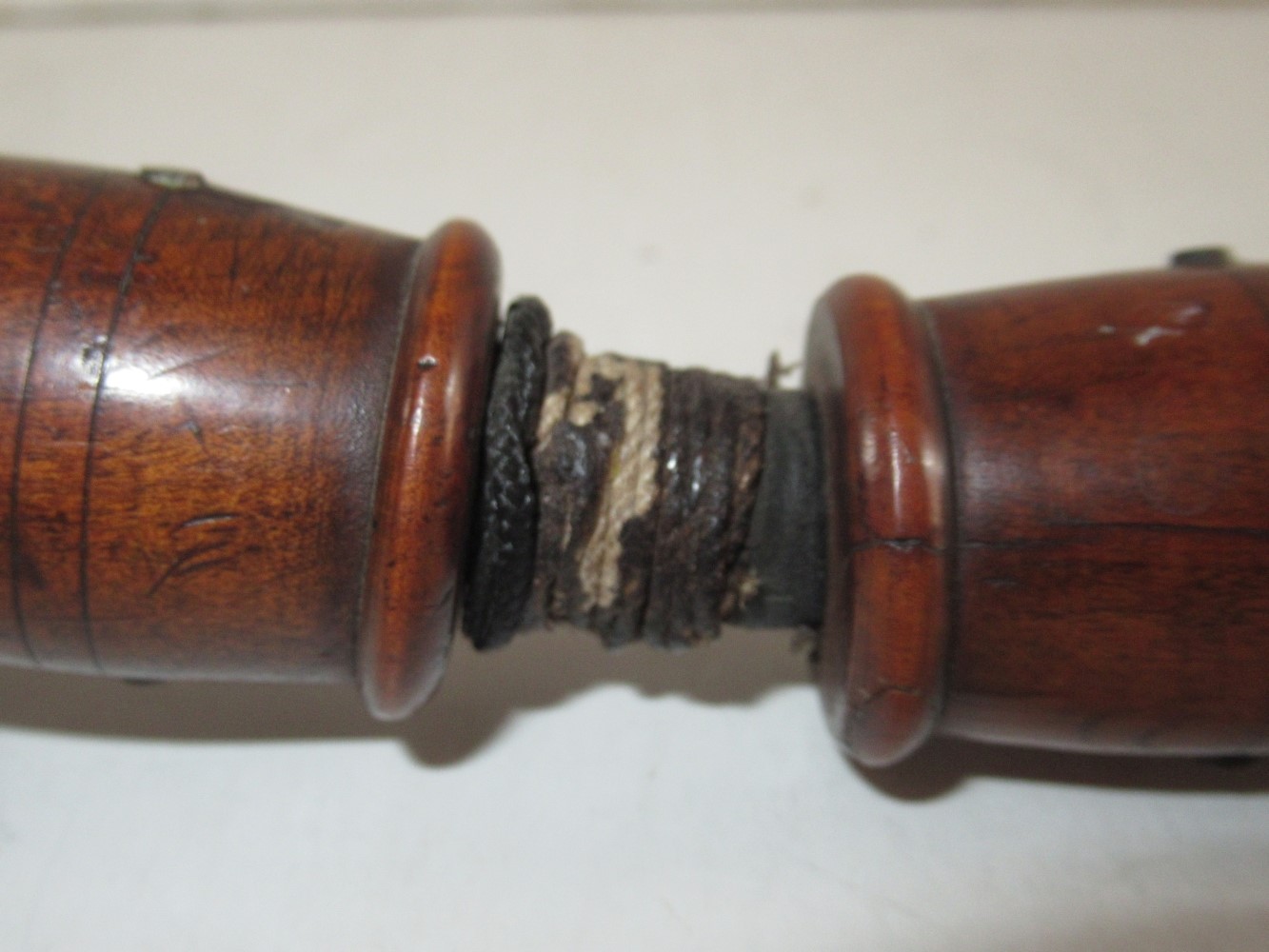 Lot 170 - AN EARLY 19TH CENTURY TURNED WOOD PRESS GANG