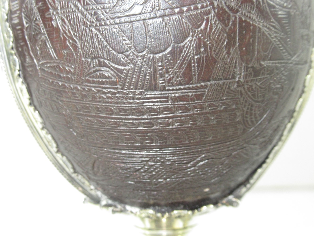 Lot 139 - AN EARLY 18TH CENTURY COCONUT CUP MOUNTED IN