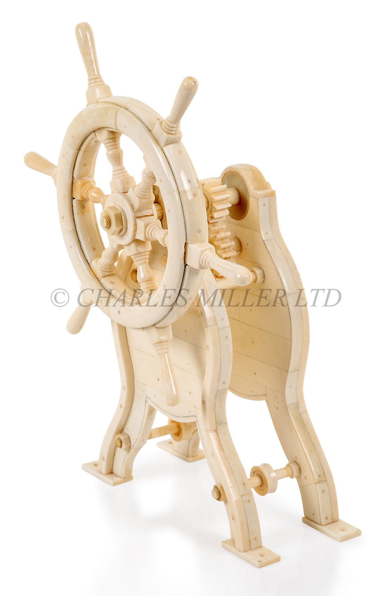 Lot 9 - A POLISHED BONE MODEL OF A SHIP'S HELM, MODERN