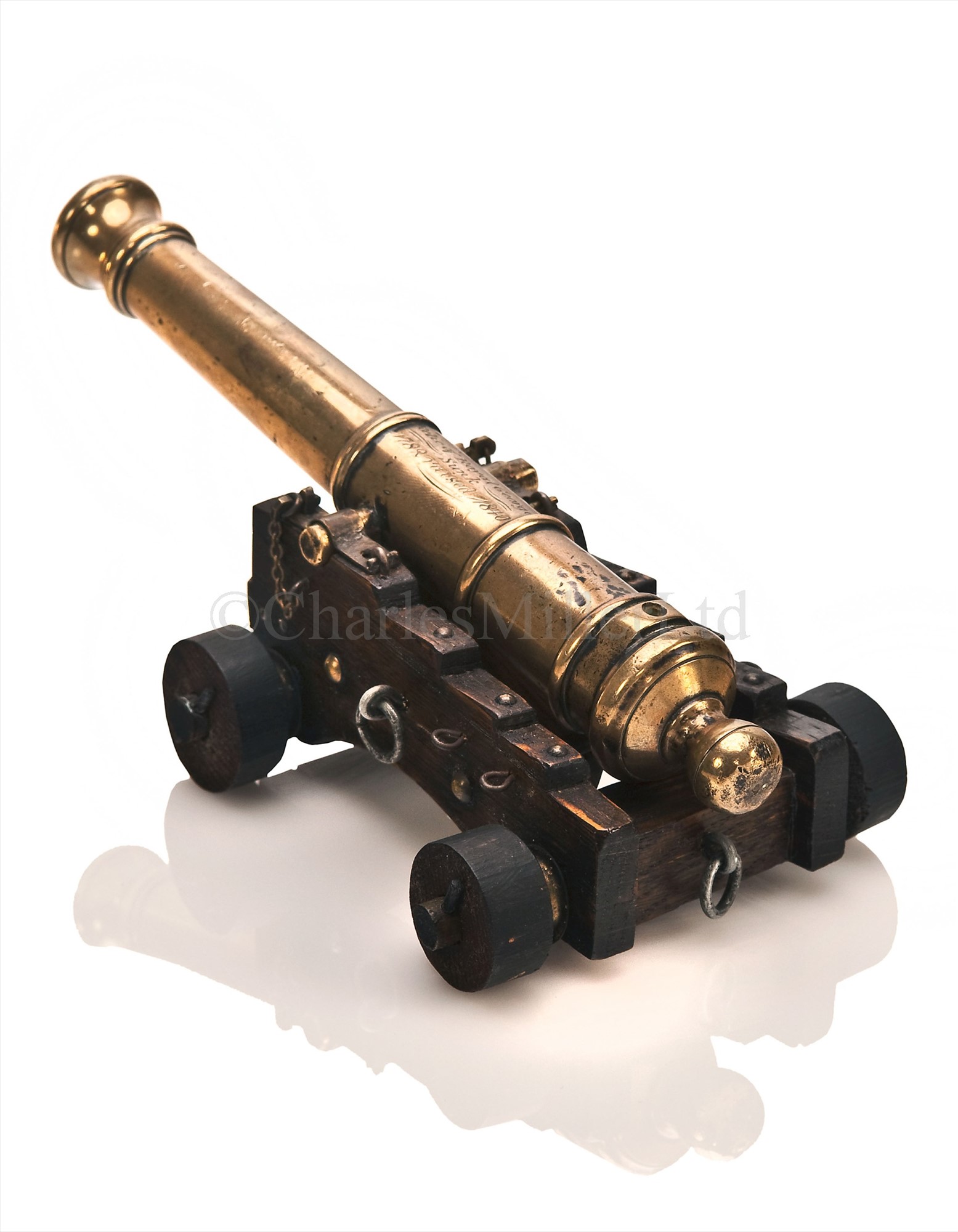Lot 113 - A MODEL CANNON MADE OF BRASS RECOVERED FROM..